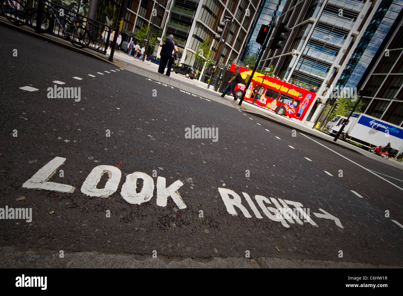 Shot of a typical sign on the road in London. Sightseeing bus and ...