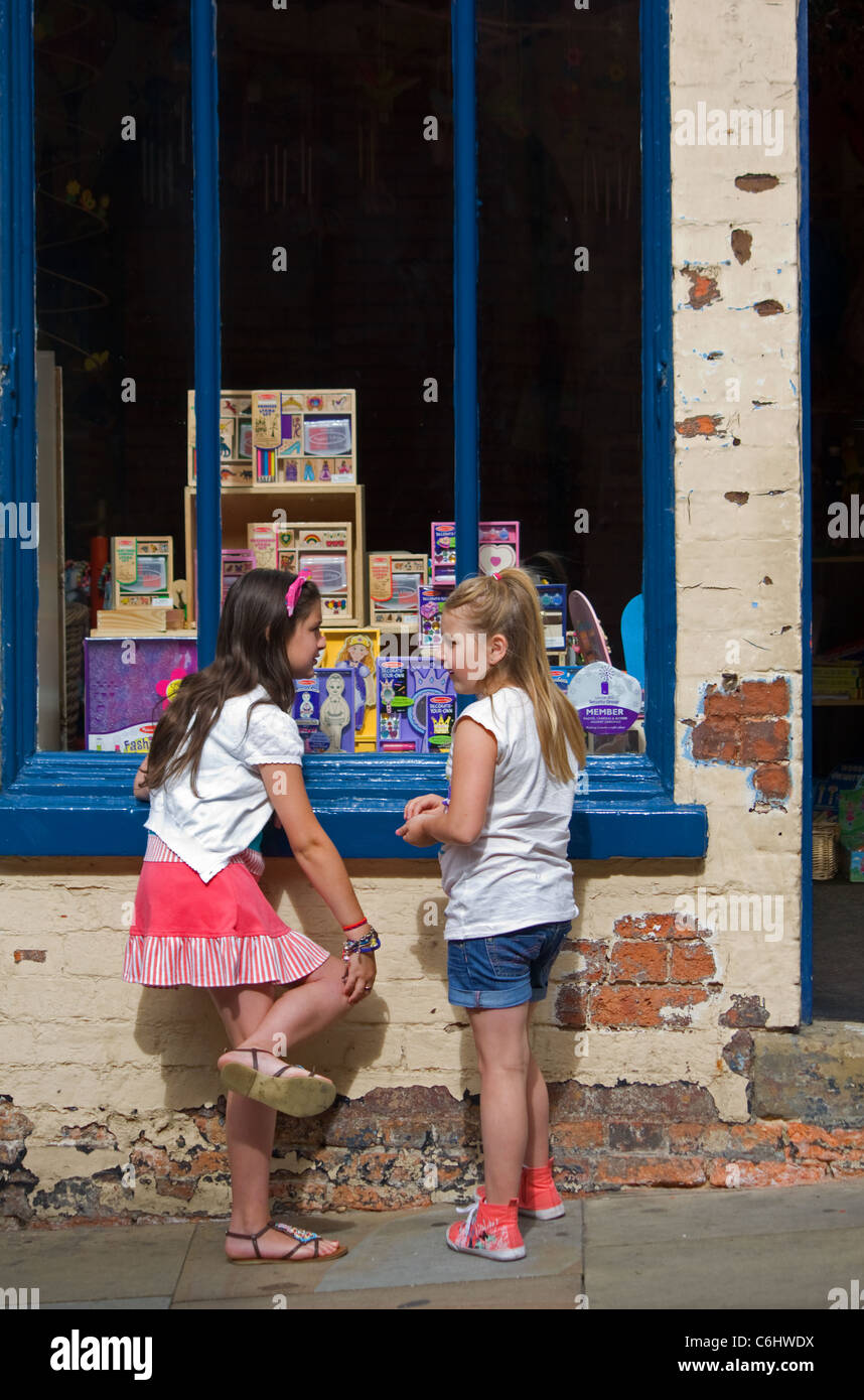 Two children looking toy shop hi-res stock photography and images - Alamy
