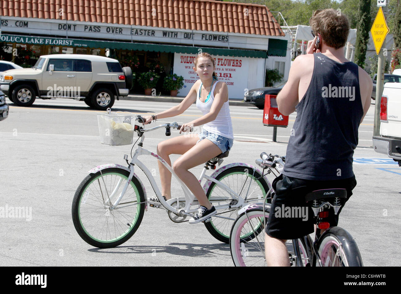 Miley cyrus rides bicycle boyfriend hi-res stock photography and images ...