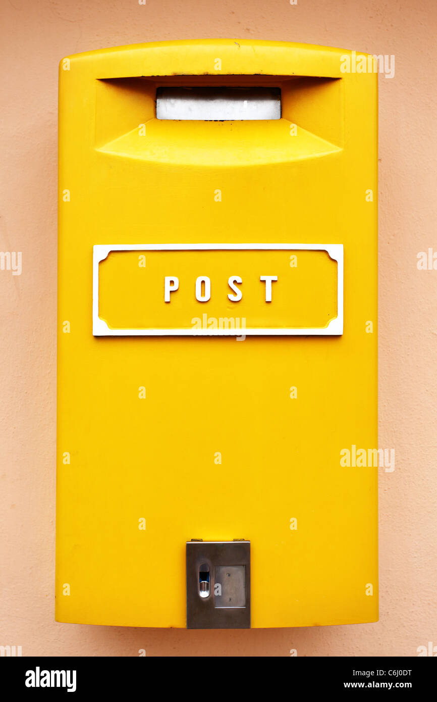 Yellow metal mail box close up Stock Photo - Alamy