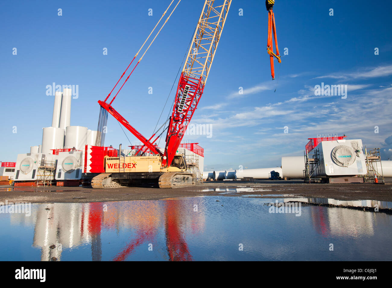 Offshore wind turbine parts on the docks at Mostyn Stock Photo - Alamy