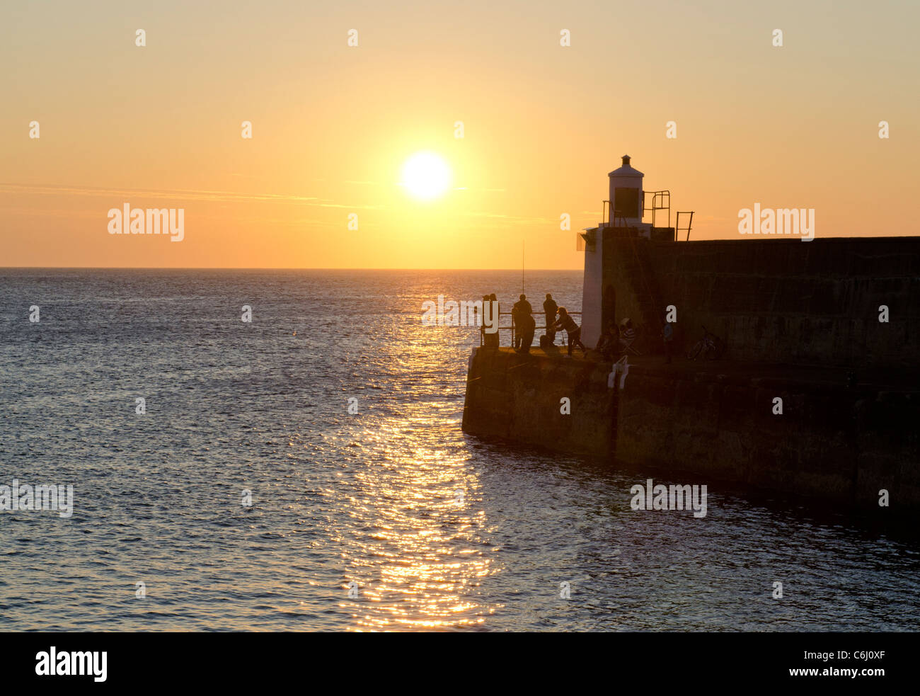 Fishermen on Pier at sunset - Whitehills Harbour - Moray Coast ...