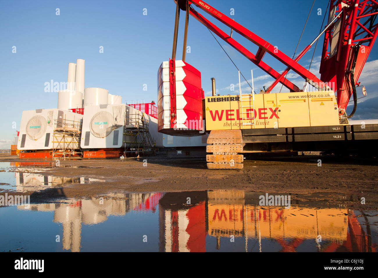 Offshore wind turbine parts on the docks at Mostyn Stock Photo - Alamy