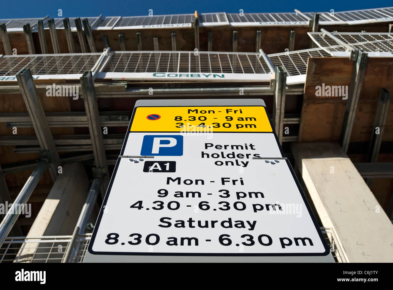 parking sign giving times and days when parking is not restricted to ...