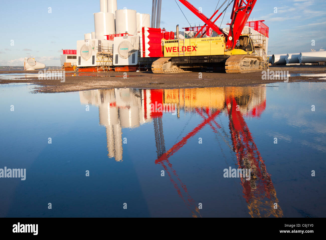 Offshore wind turbine parts on the docks at Mostyn Stock Photo - Alamy
