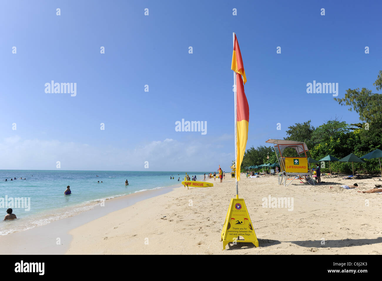 red& yellow flag on beach, Green Island, Great Barrier Reef, Queensland ...