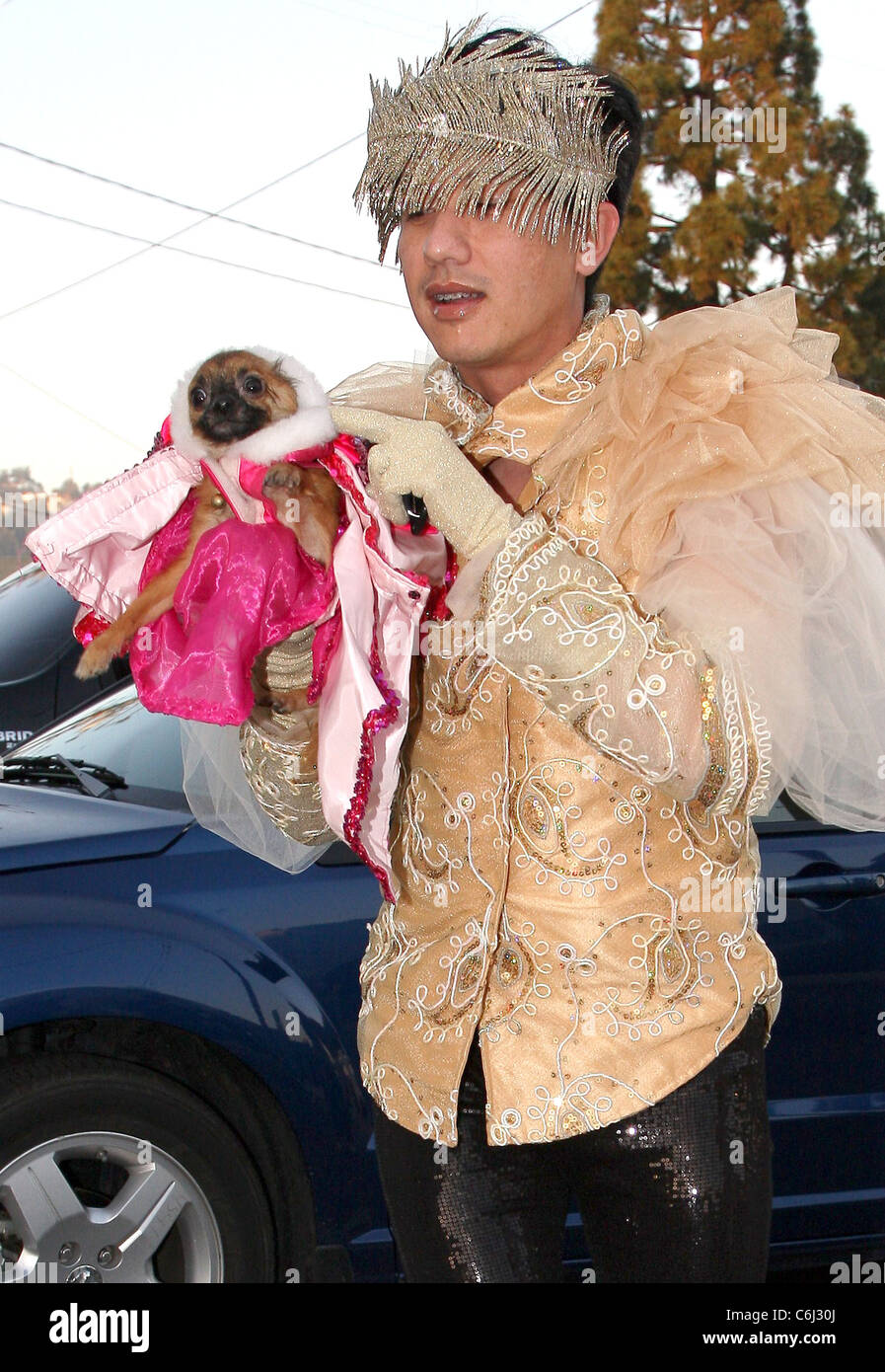 Bobby Trendy outside Maxfield in Beverly Hills while holding his dog ...