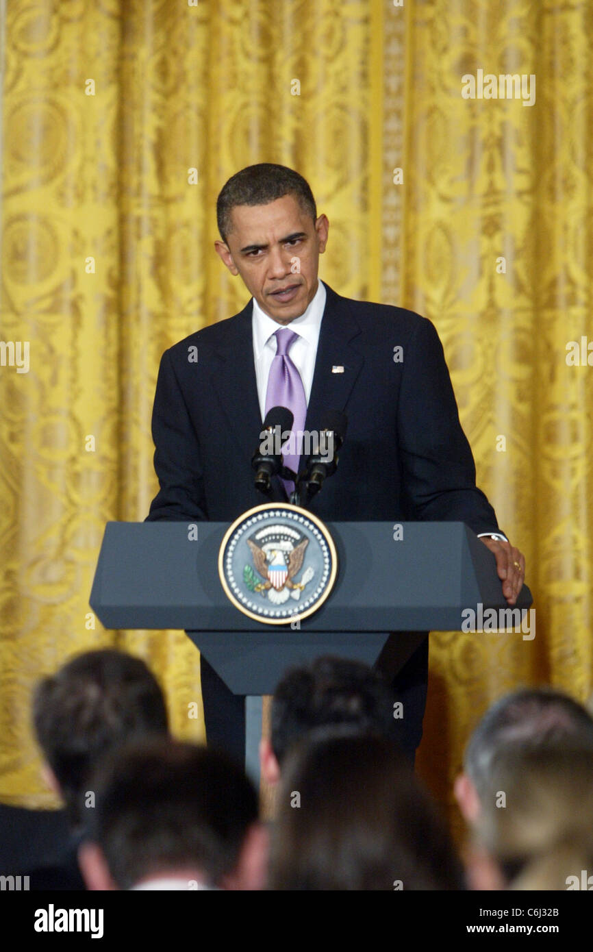 U.S. President Barack Obama (R) speaks during a joint news conference ...