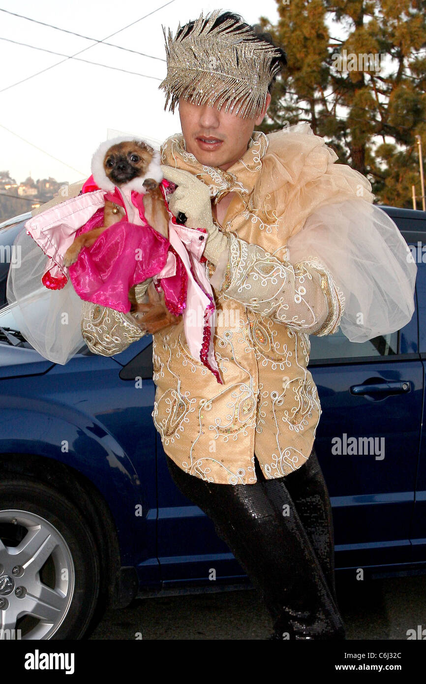 Bobby Trendy outside Maxfield in Beverly Hills while holding his dog ...