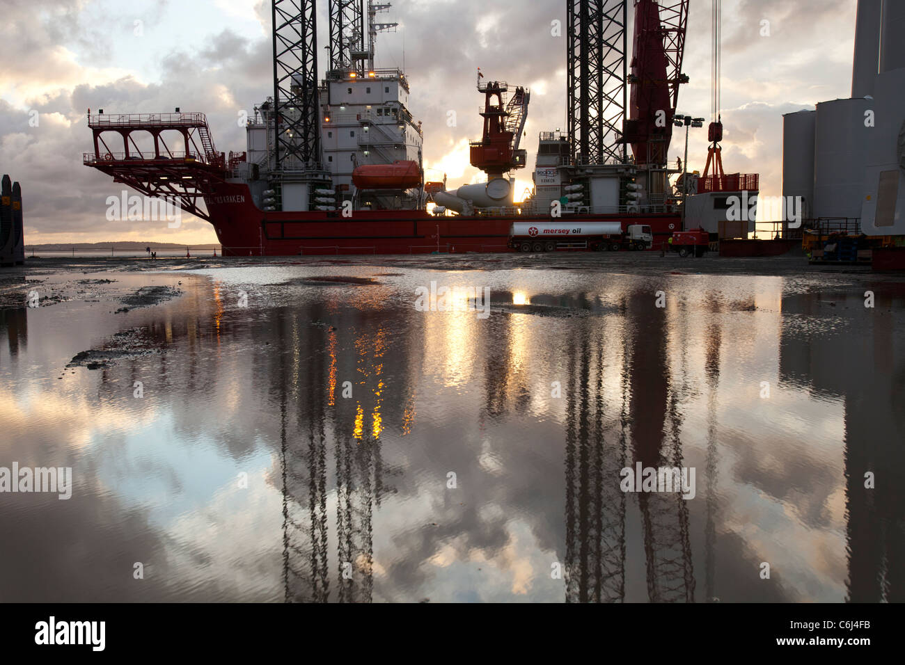 A jack up barge at Mostyn port and wind turbine parts Stock Photo - Alamy