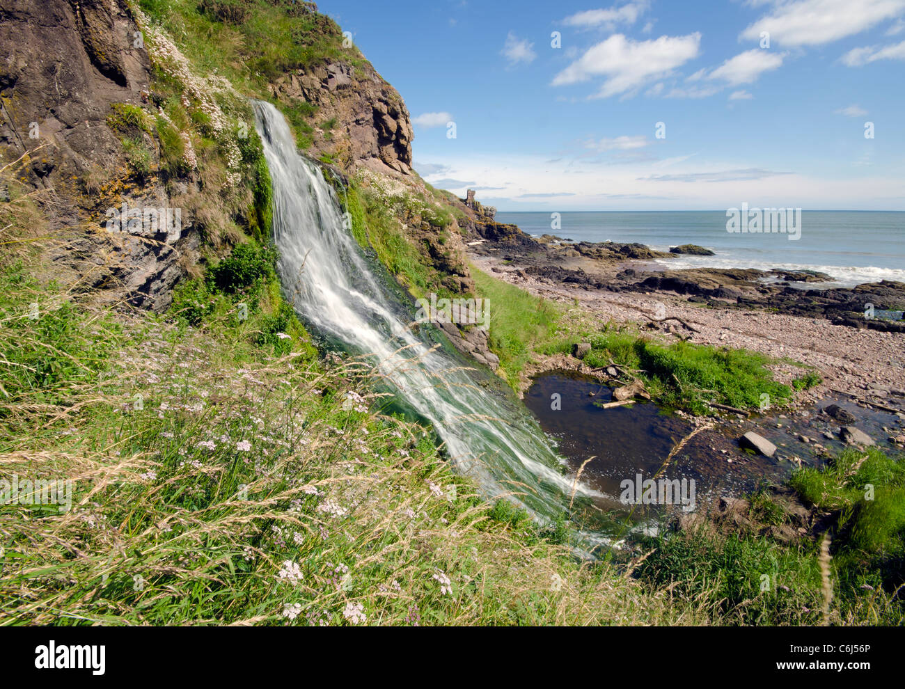 St Cyrus Nature Reserve waterfall and cliffs with ruined castle at ...