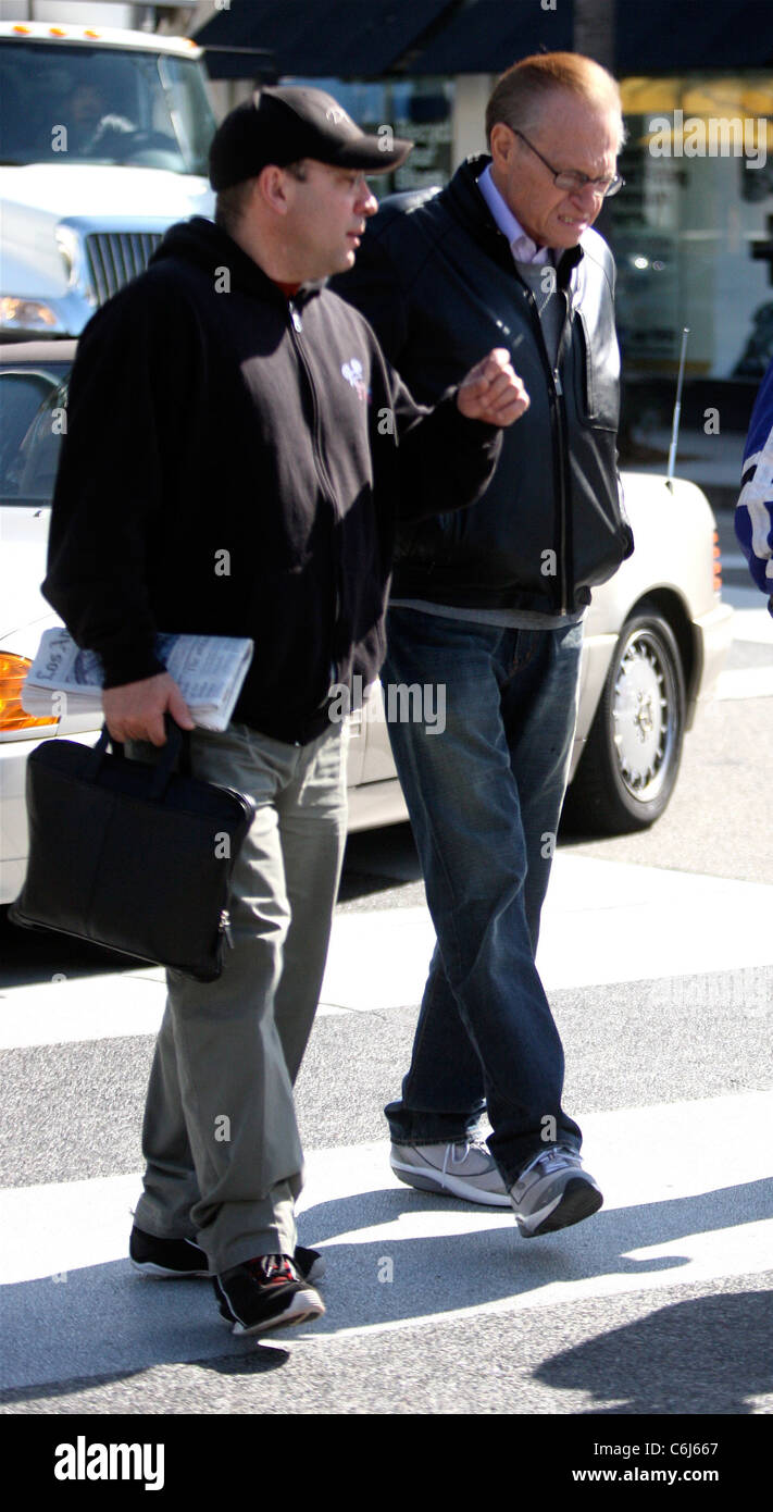 Larry King out for a walk with a friend in Beverly Hills Los Angeles ...