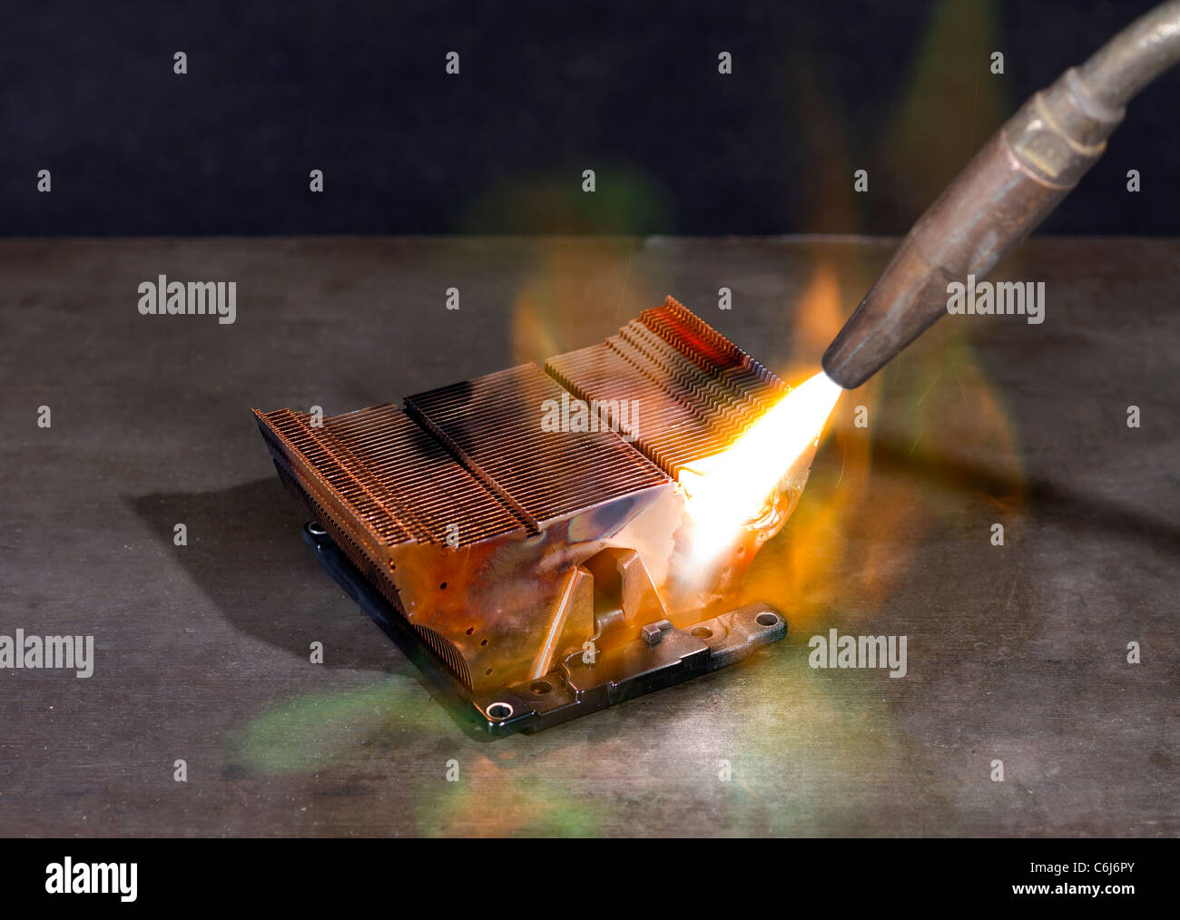 heating up a cooling element with a blowpipe Stock Photo - Alamy