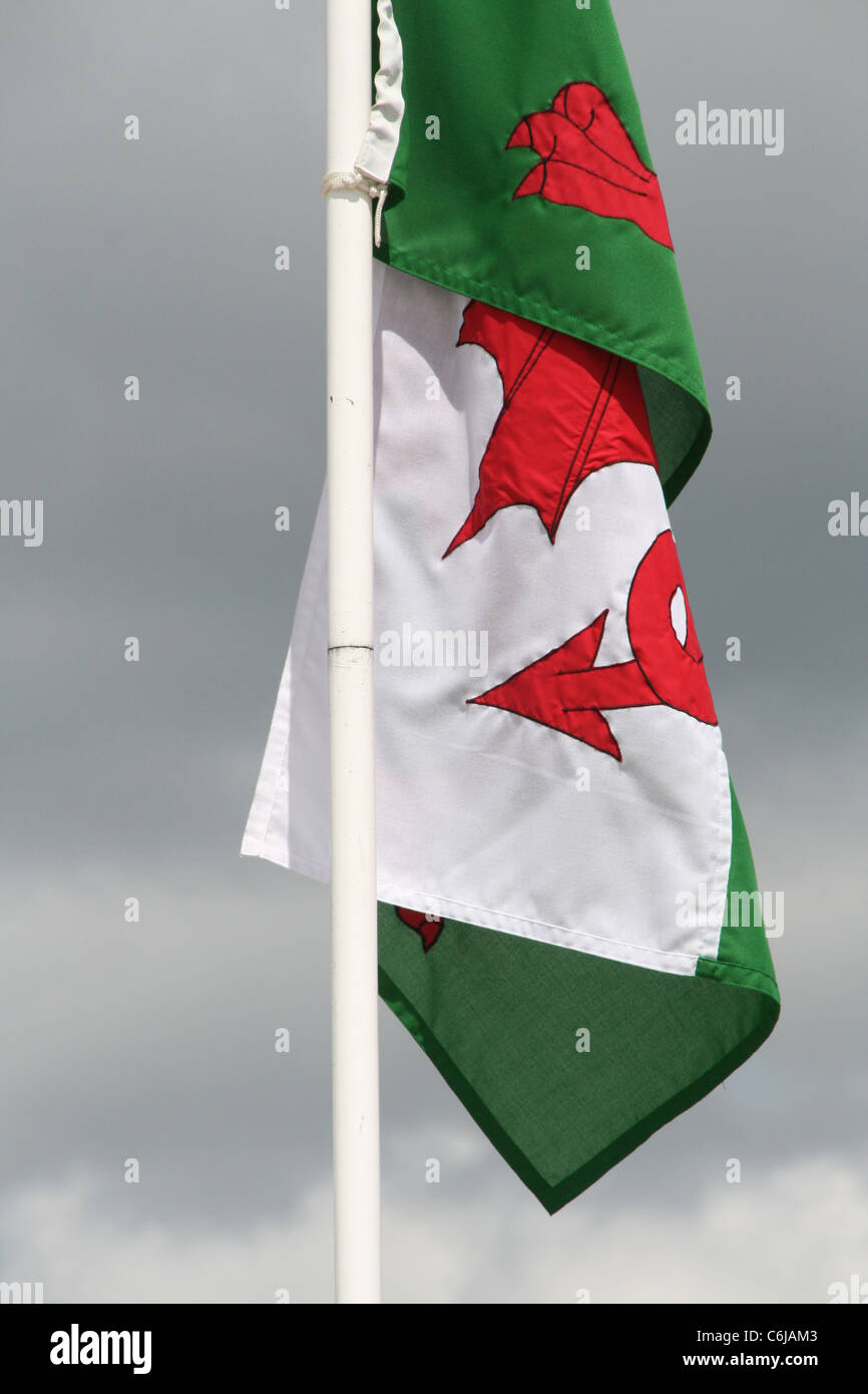 welsh banner on flagpole in blue sky in sun Stock Photo - Alamy