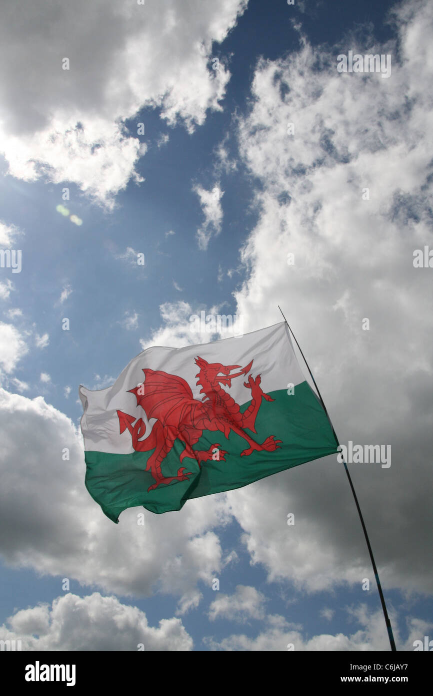 welsh banner on flagpole in blue sky in sun Stock Photo - Alamy