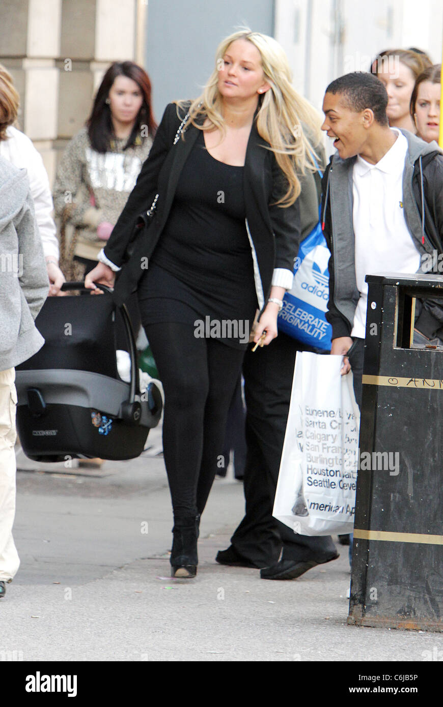 Jennifer Ellison carrying her son Bobby in a baby carrier while out and ...