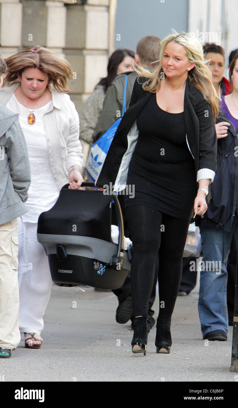 Jennifer Ellison carrying her son Bobby in a baby carrier while out and ...
