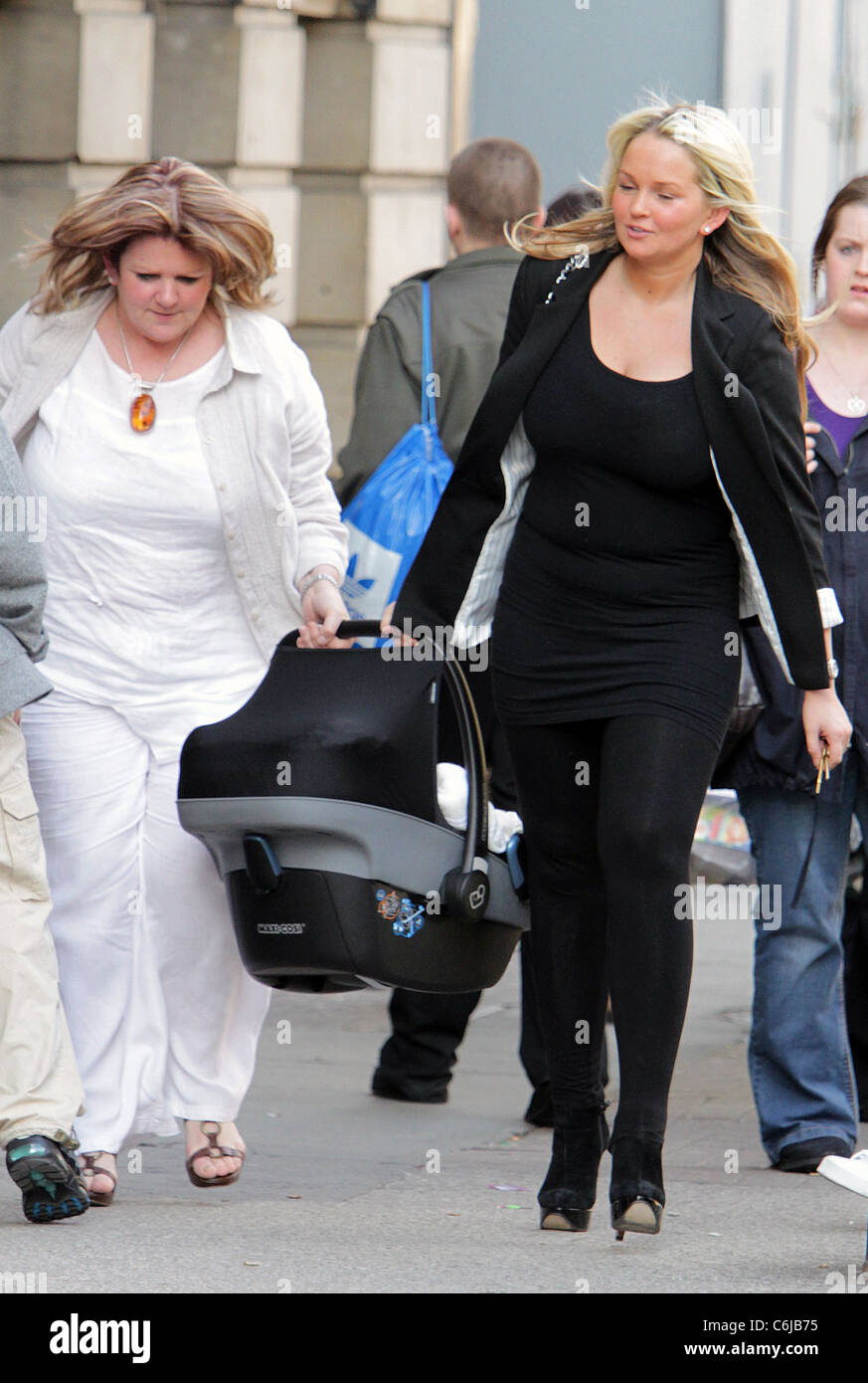Jennifer Ellison carrying her son Bobby in a baby carrier while out and ...