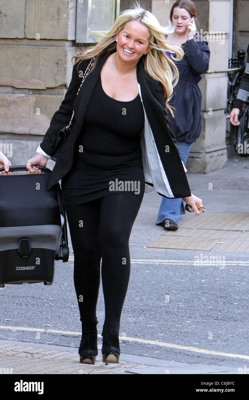 Jennifer Ellison carrying her son Bobby in a baby carrier while out and ...