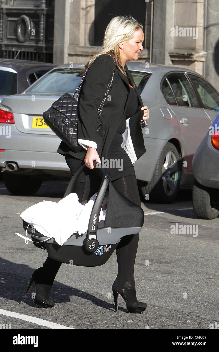 Jennifer Ellison carrying her son Bobby in a baby carrier while out and ...