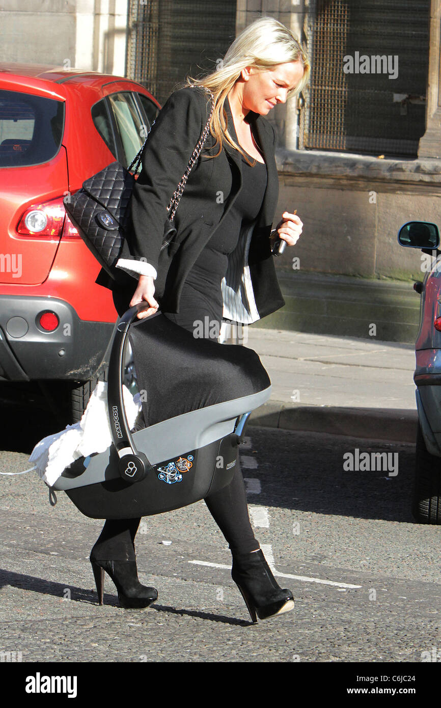 Jennifer Ellison carrying her son Bobby in a baby carrier while out and ...