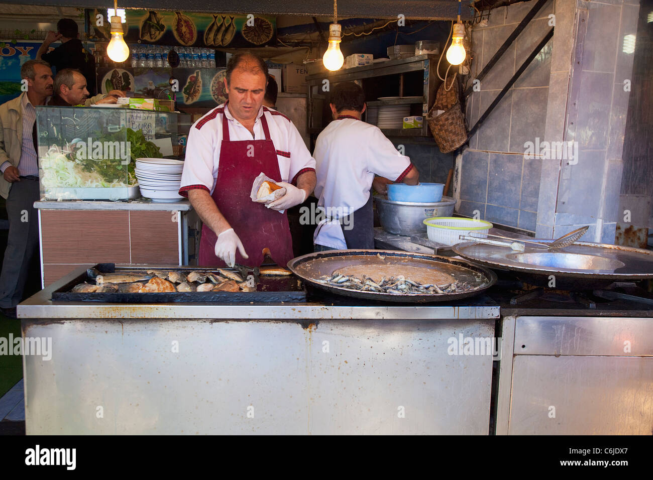 Turkey, Istanbul, Karakoy, Galata fish market, stall selling fried fish ...