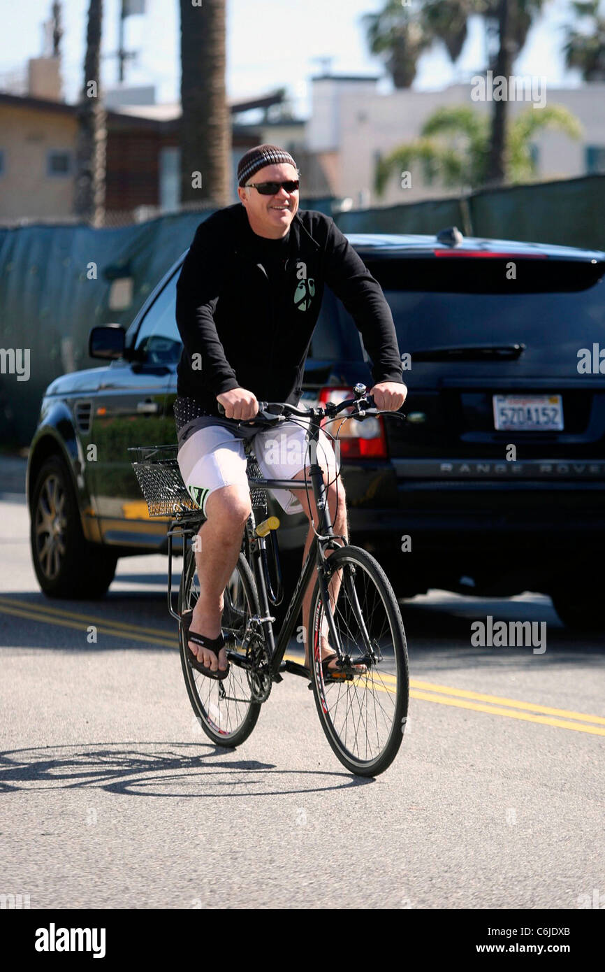 Tim Robbins riding his bicycle in Venice, enjoying the sunny California ...