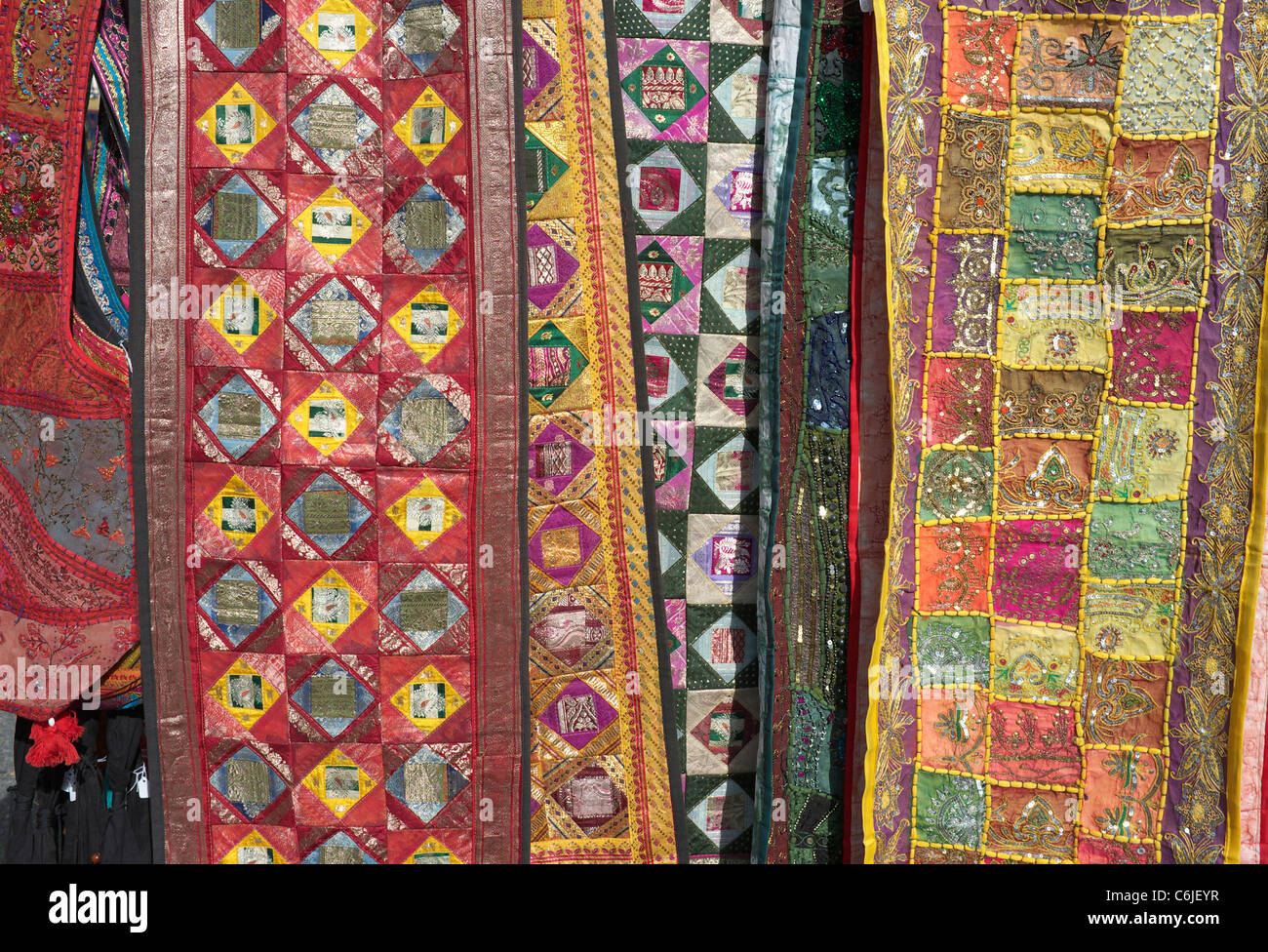 Patchwork quilts hanging in a market Stock Photo - Alamy