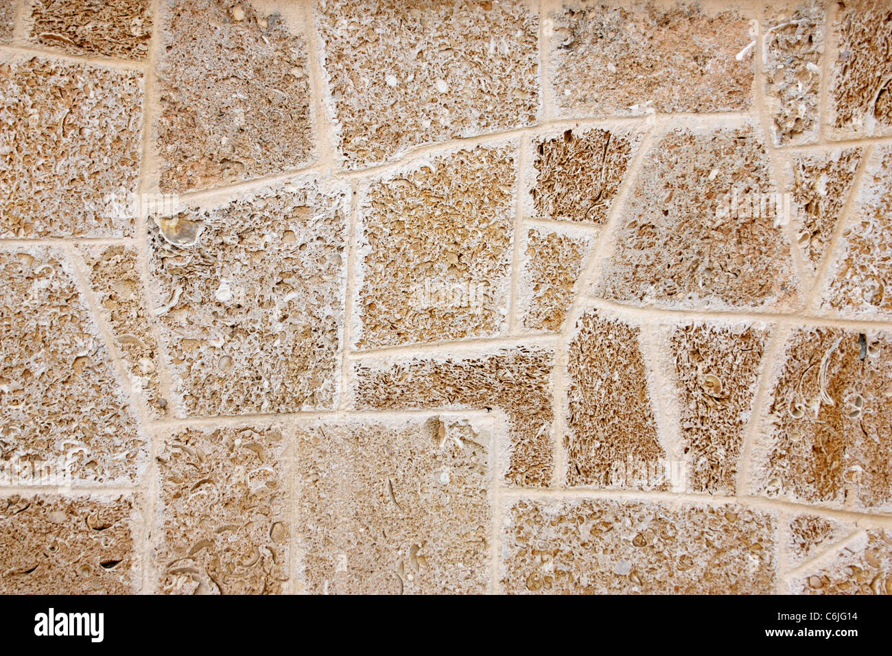 Wall of limestone formed by different geometric forms Stock Photo - Alamy