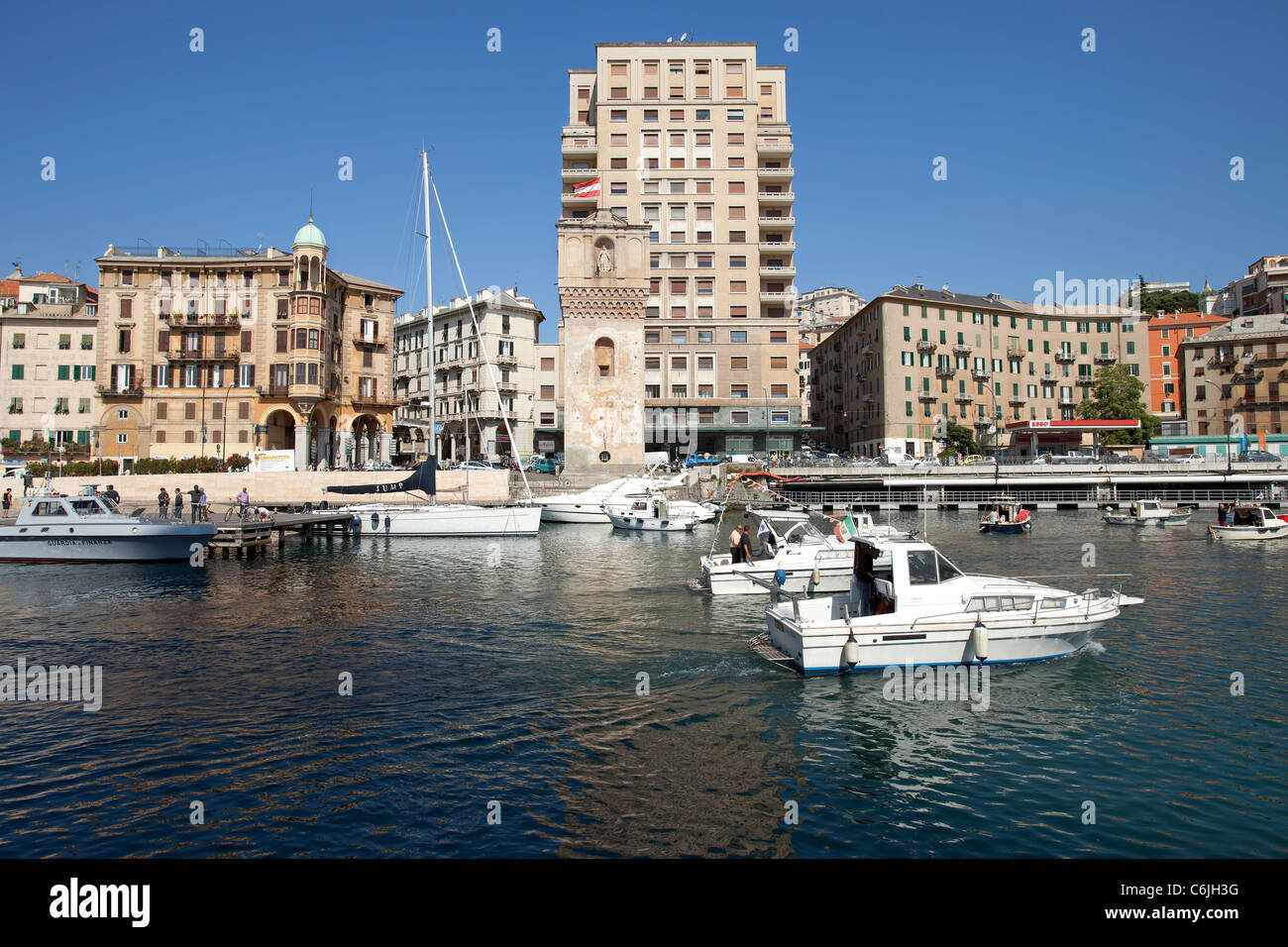 Savona Italy city center across marina with sailboats, fishing boats ...