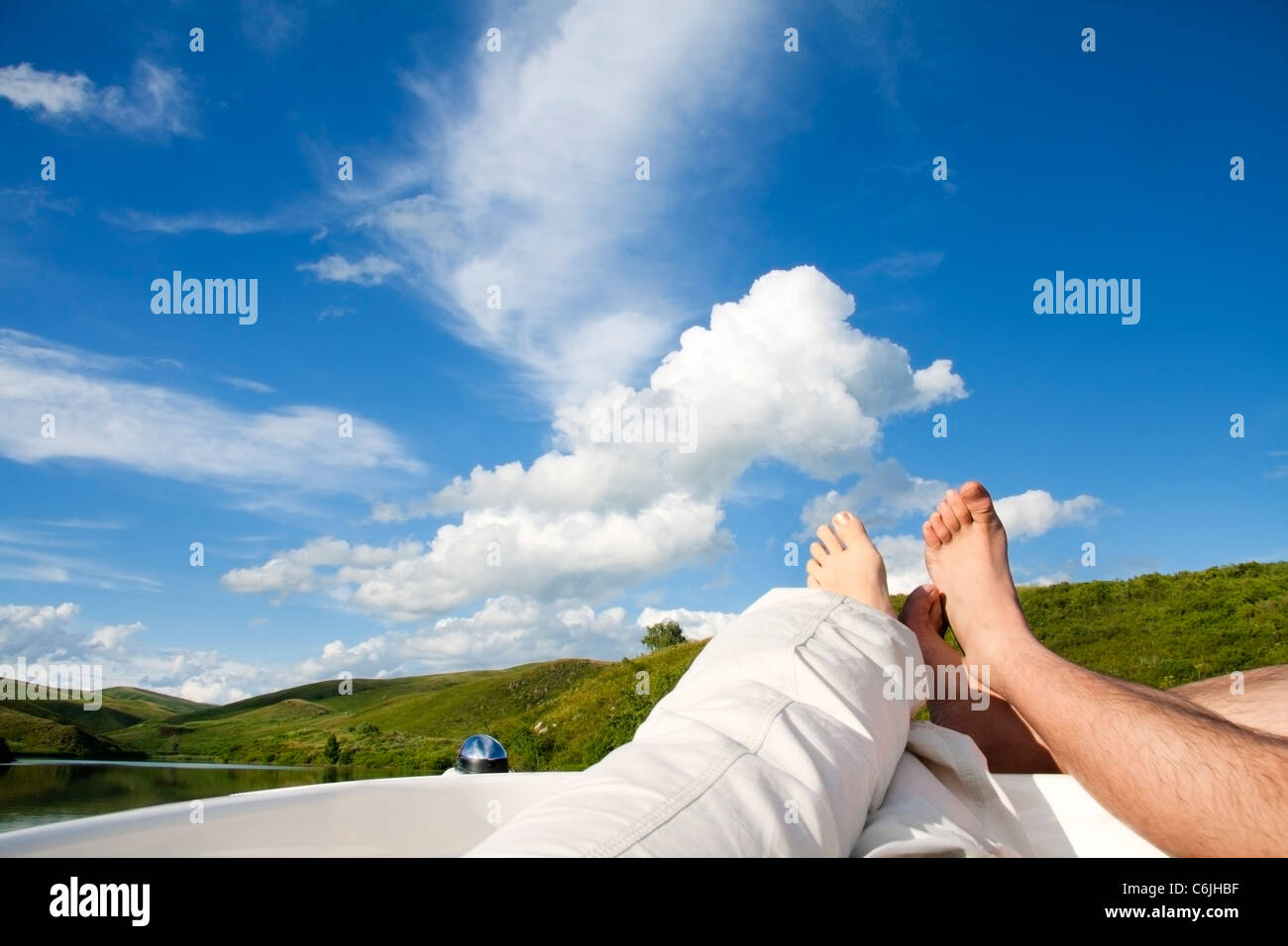 Couples relaxation in a boat on the river Stock Photo - Alamy