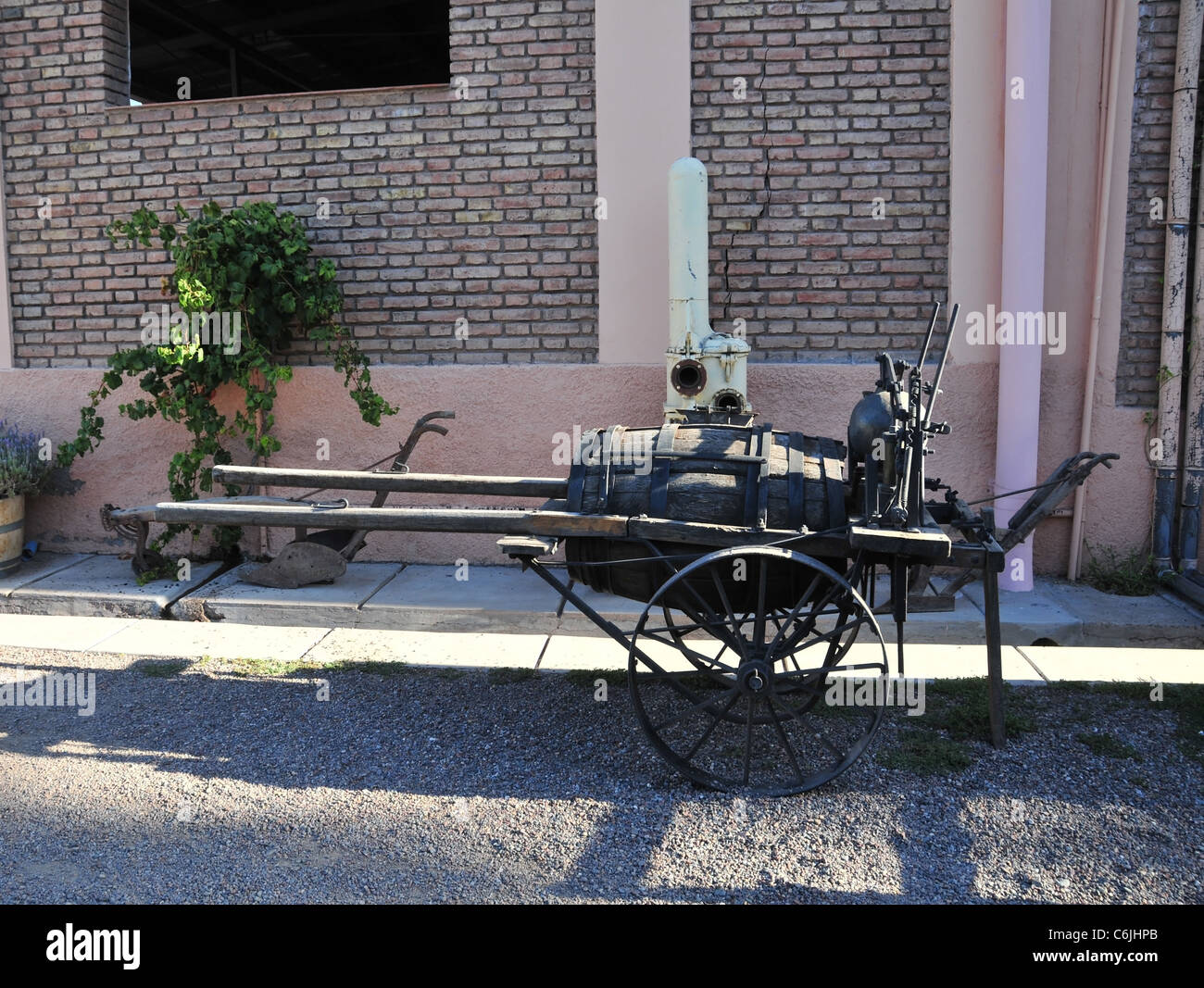 Sunny view antique portable pump-piston, small museum old wine-making ...