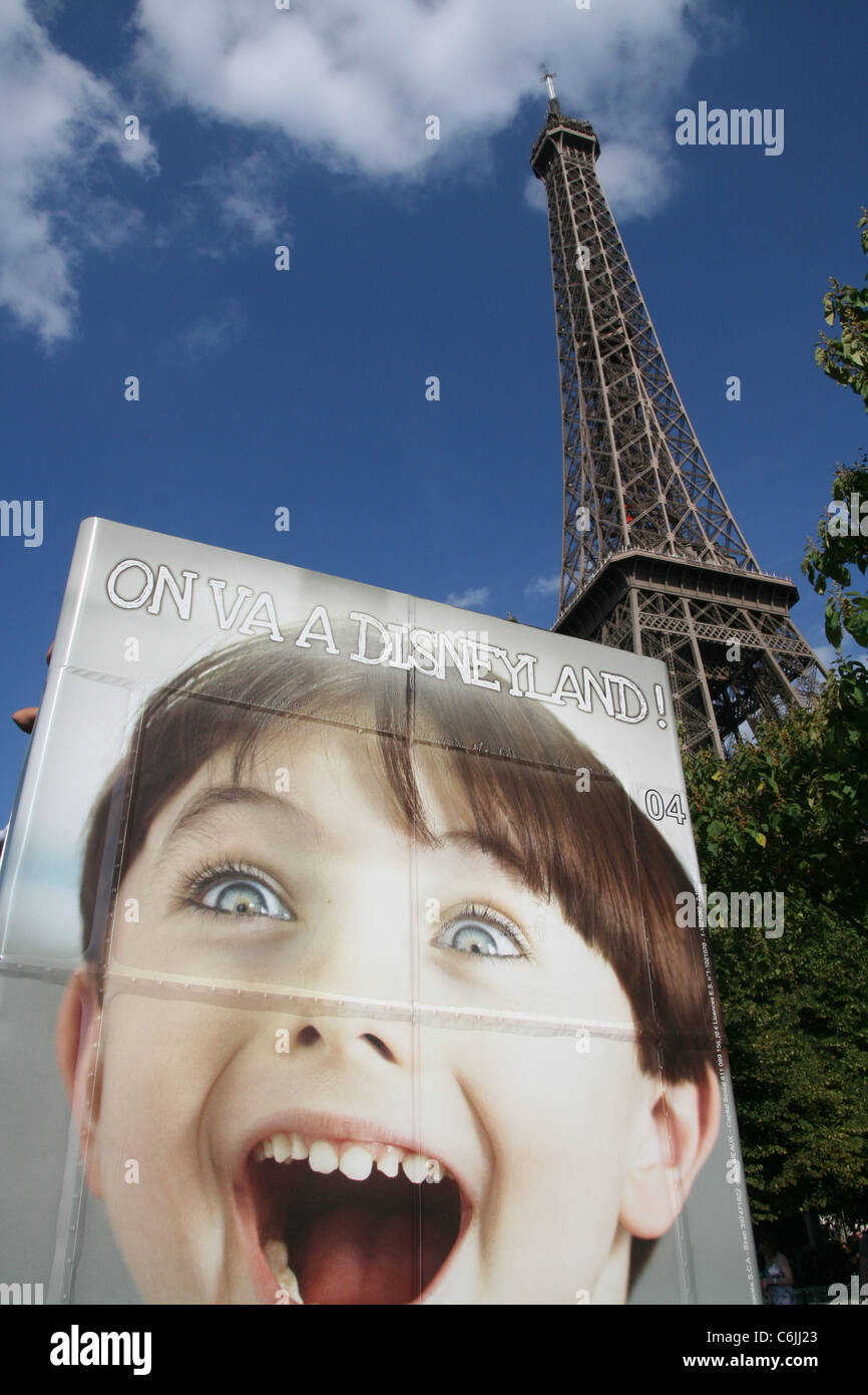 bus with disneyland advert by the eiffel tower in paris france Stock ...
