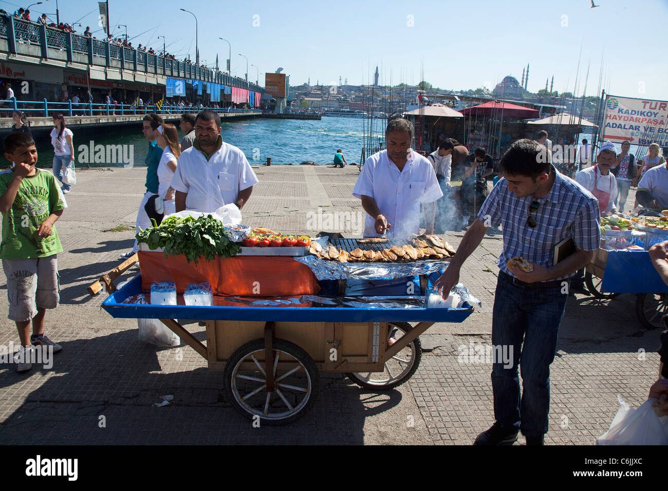 Turkey, Istanbul, Karakoy, Galata fish market, man selling freshly ...