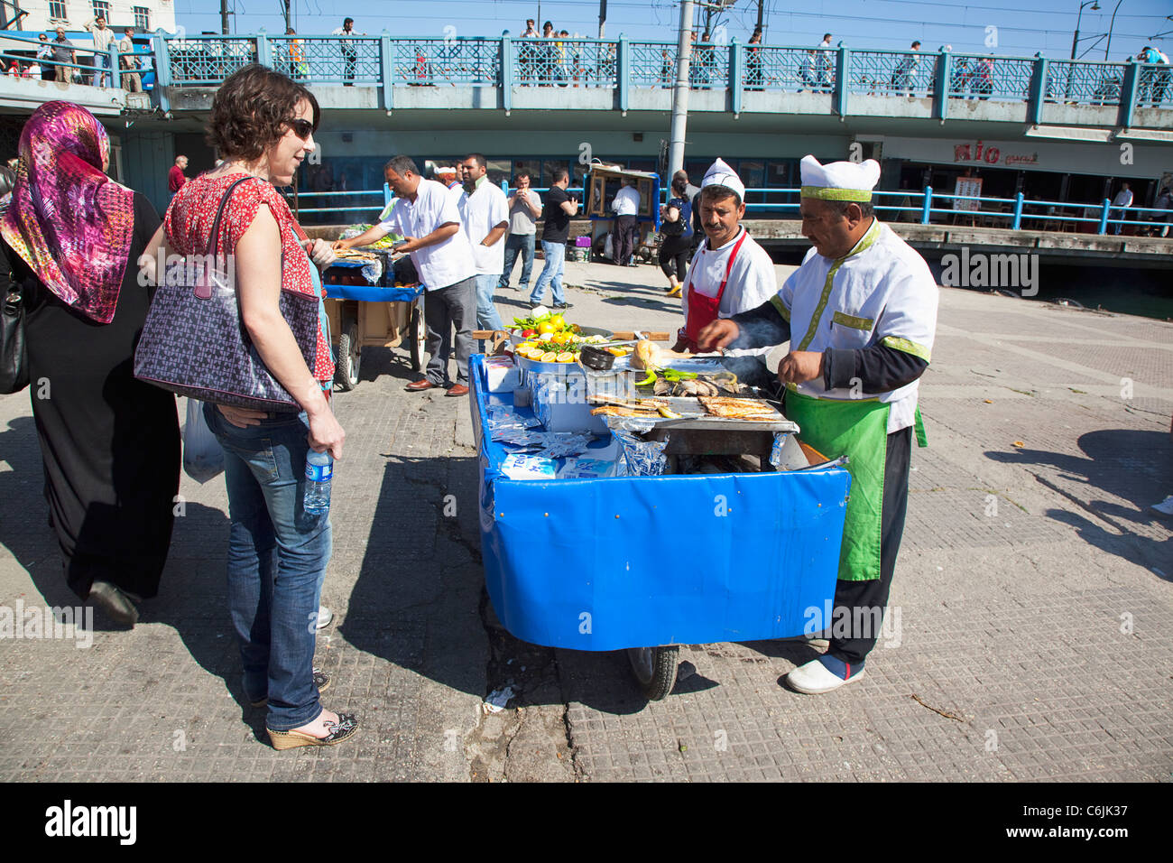 Turkey, Istanbul, Karakoy, Galata fish market, man selling freshly ...