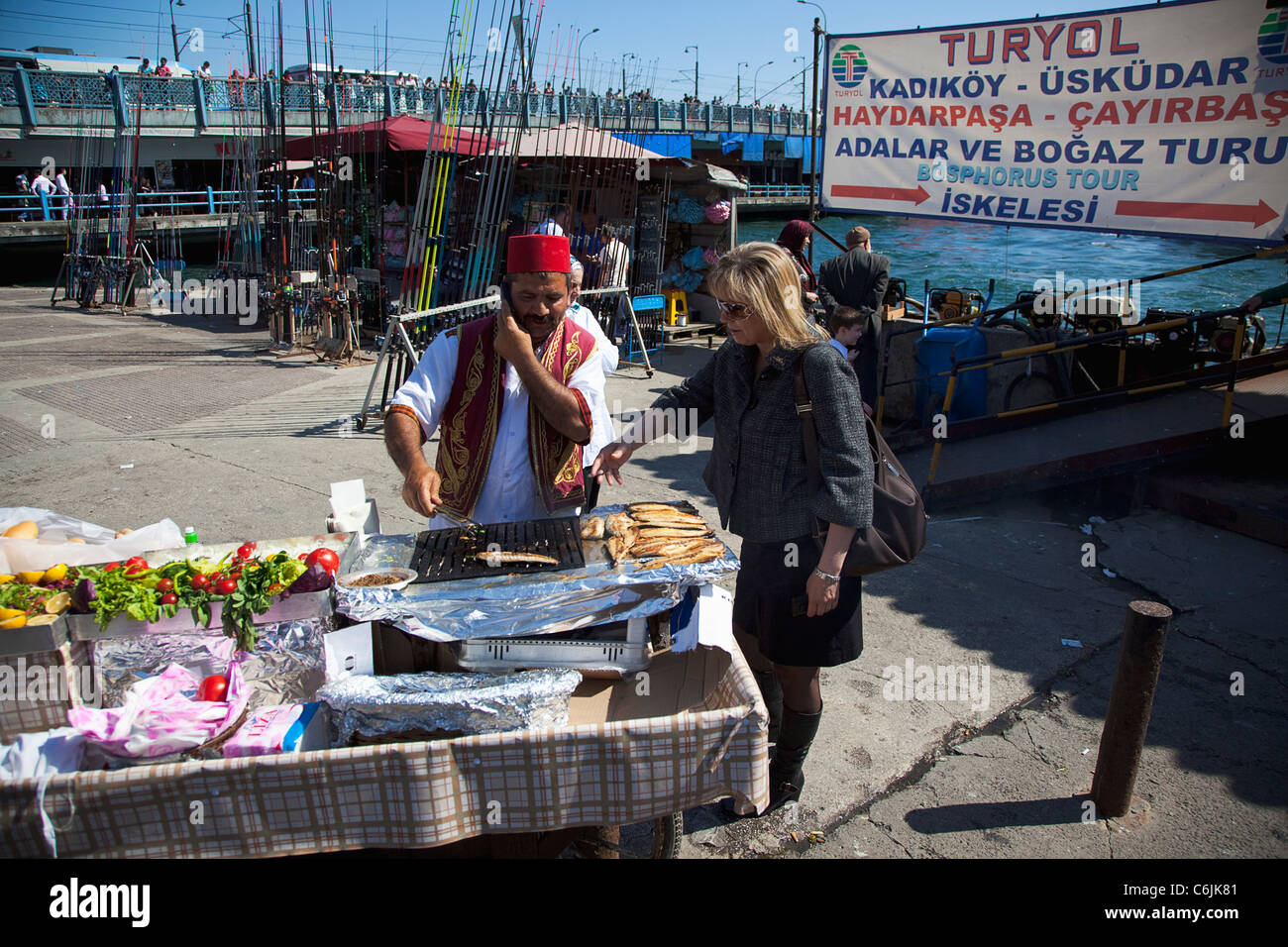 Turkey, Istanbul, Karakoy, Galata fish market, man selling freshly ...