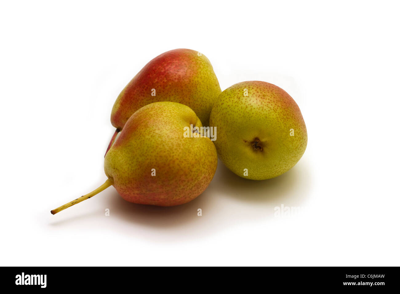 Three ripe Forelle pears on a white background Stock Photo - Alamy