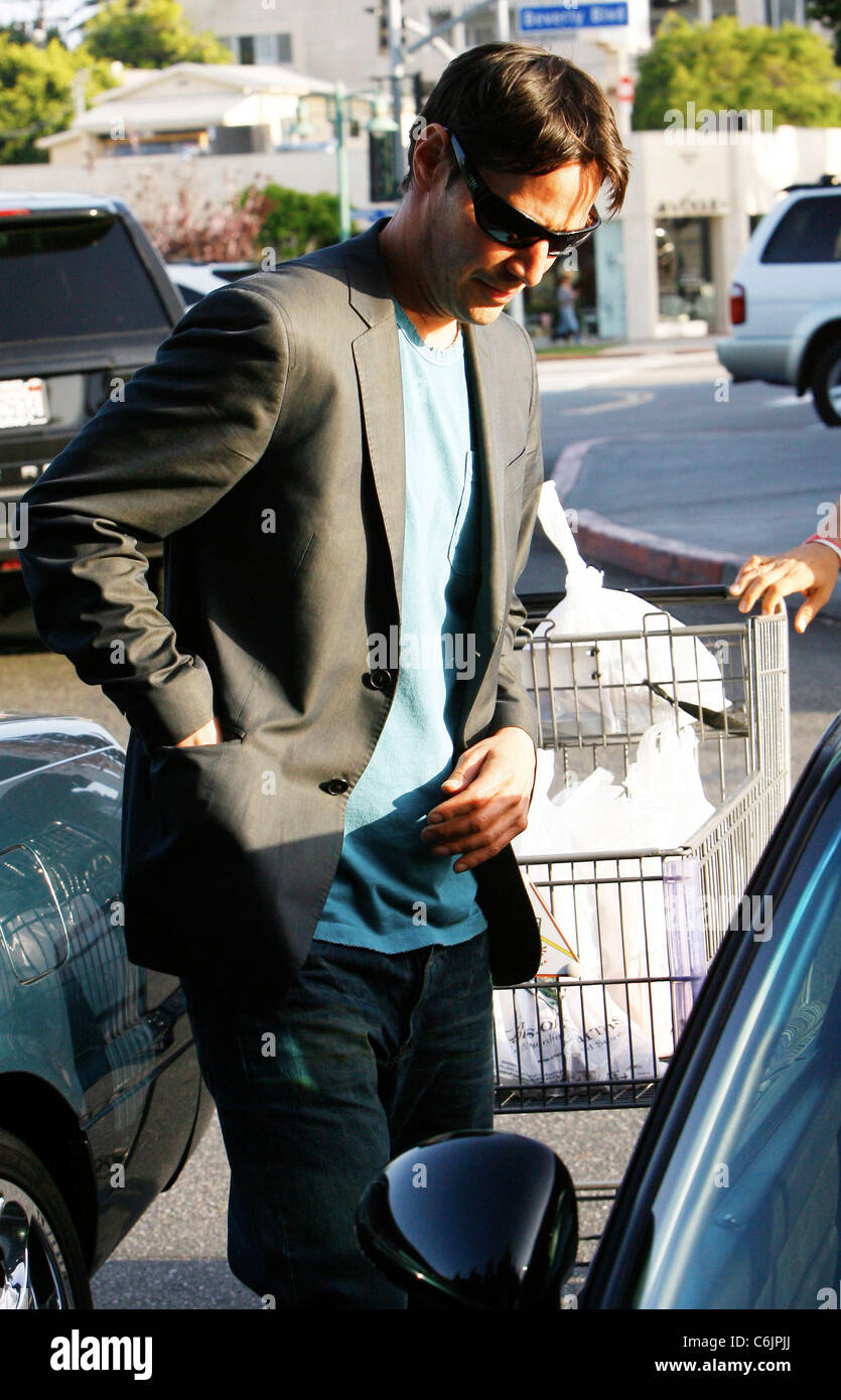 Keanu Reeves and a friend leaving Bristol Farms supermarket after ...