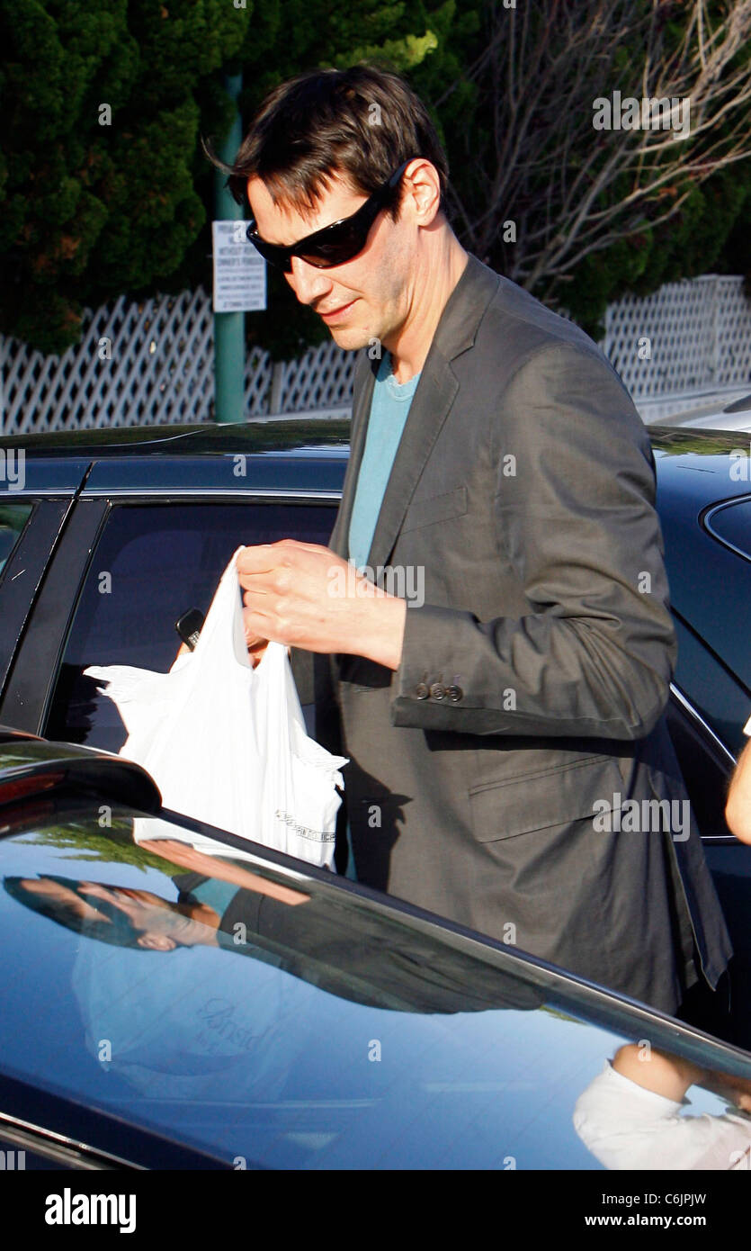 Keanu Reeves and a friend leaving Bristol Farms supermarket after ...