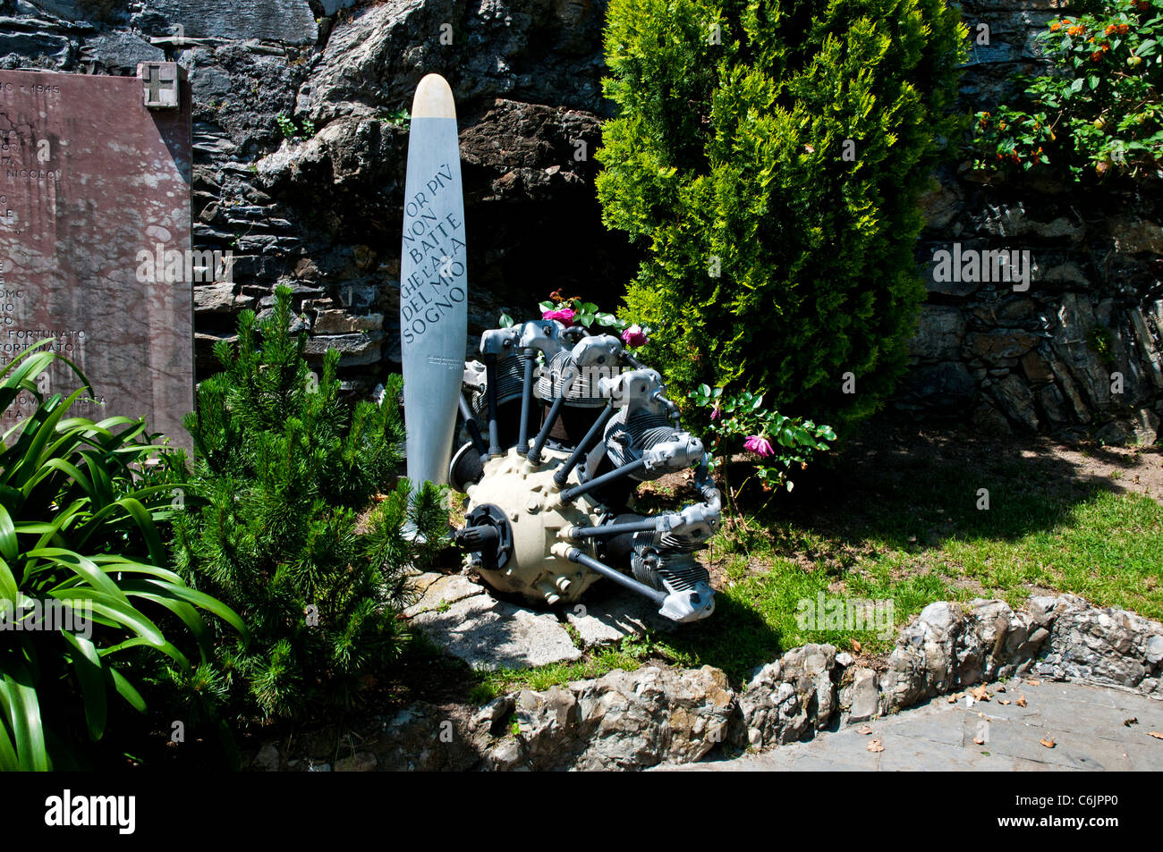 A secluded quiet area containing a memorial painted aircraft engine and ...