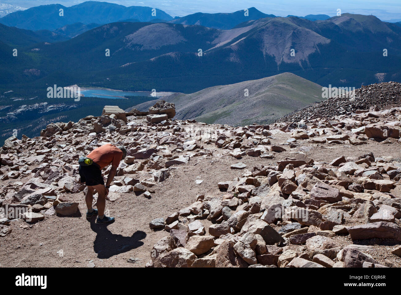 An exhausted man gasps for breath at the top of Pikes Peak after ...