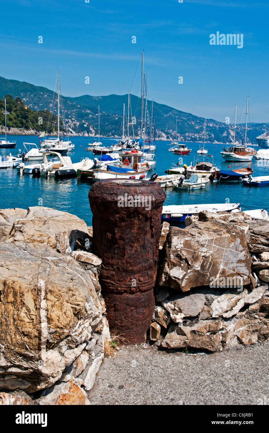 A rusty cannon barrel acts as an attractive buttress to a rock wall in ...