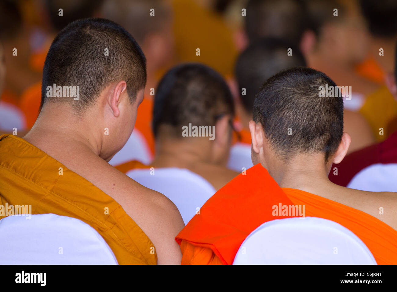 Young monks sitting by temple hi-res stock photography and images - Alamy
