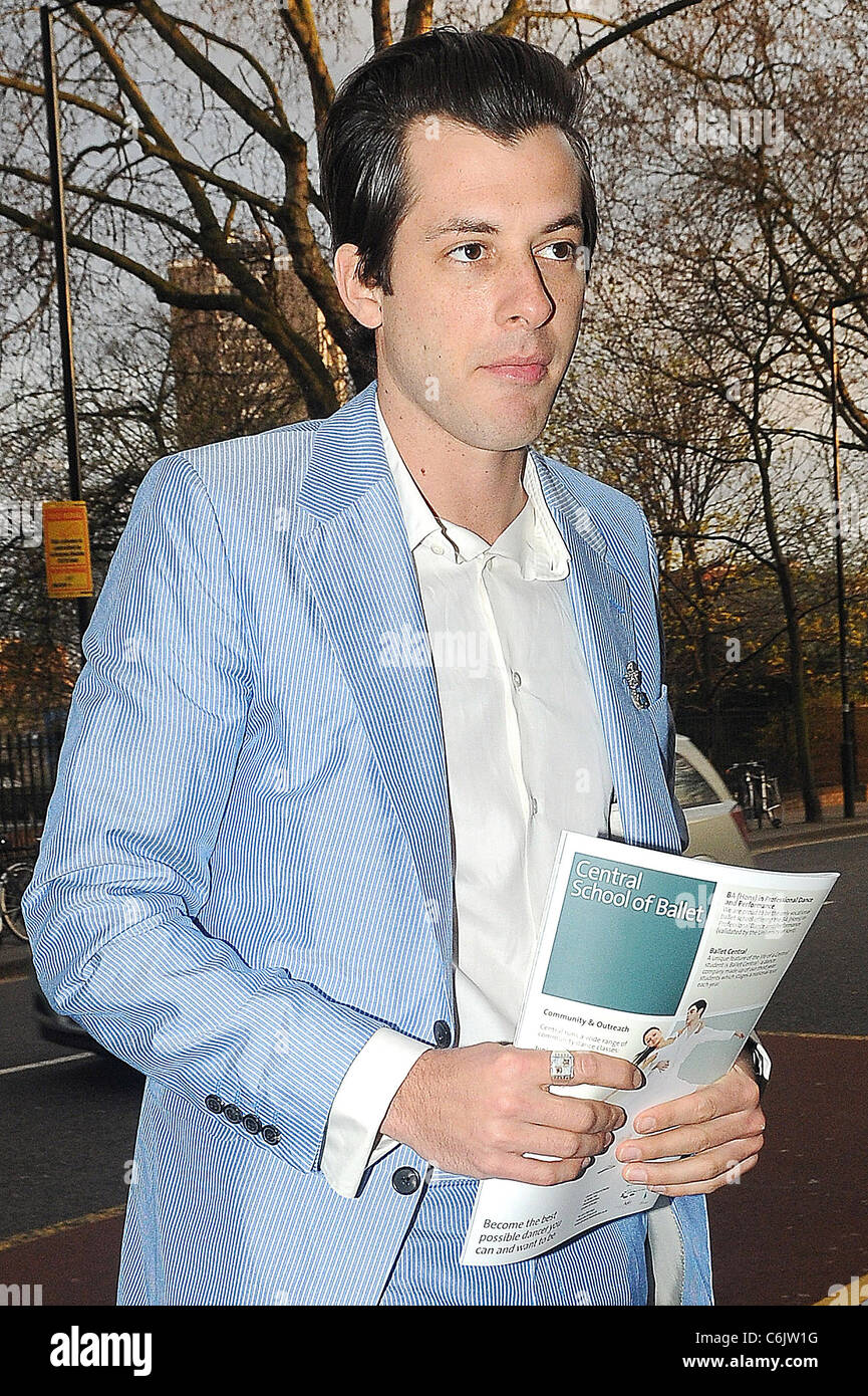 Mark Ronson, wearing a pinstripe light blue suit, leaving the Mayfair ...