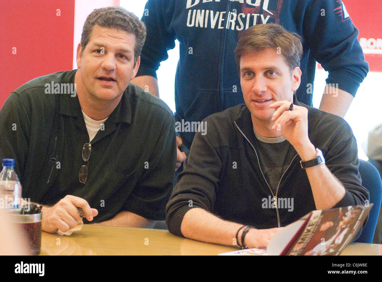 TV host Mike Greenberg and Mike Golic of ESPN, signing autographs for ...