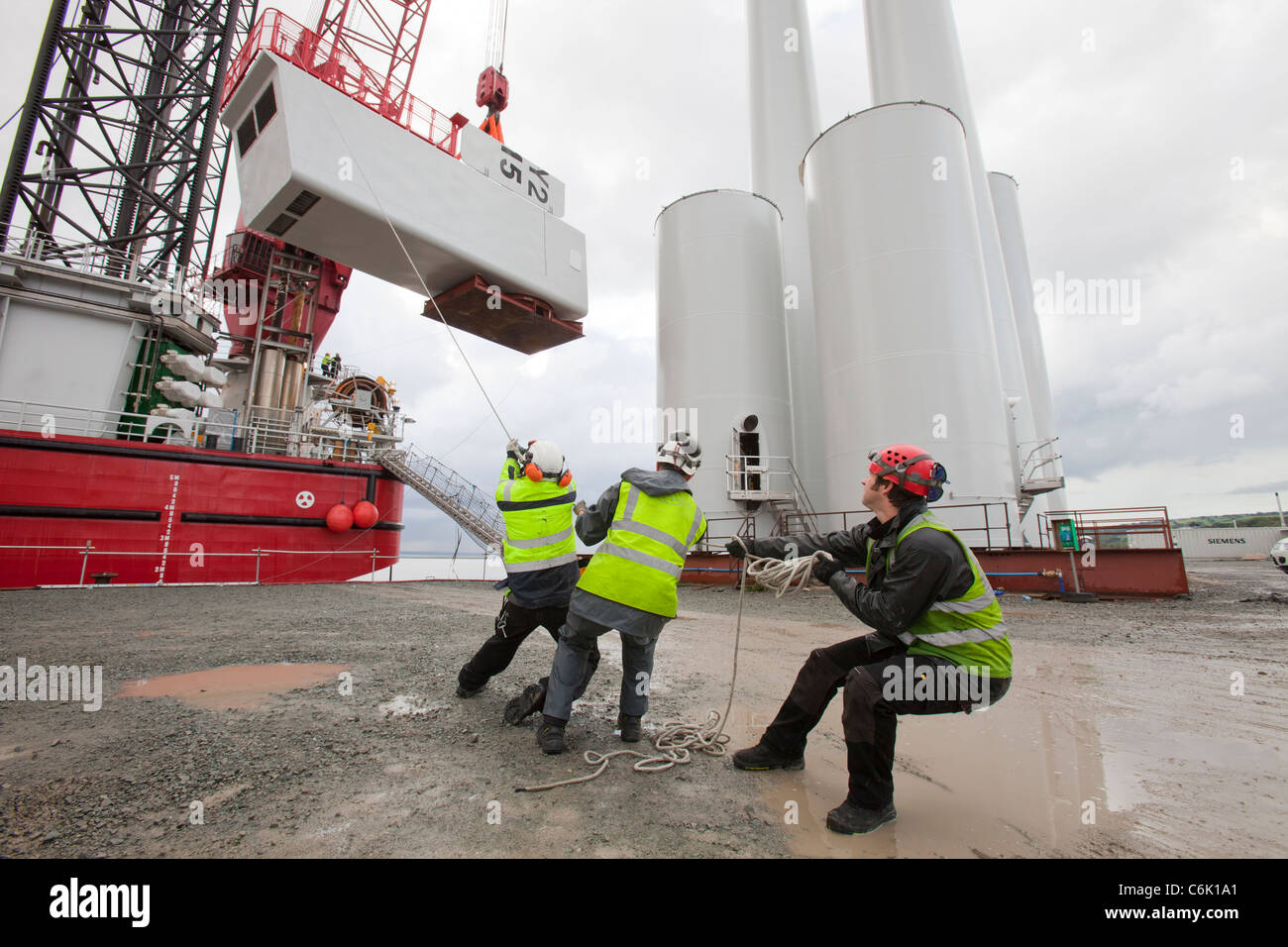 A jack up barge at Mostyn port and wind turbine parts Stock Photo - Alamy