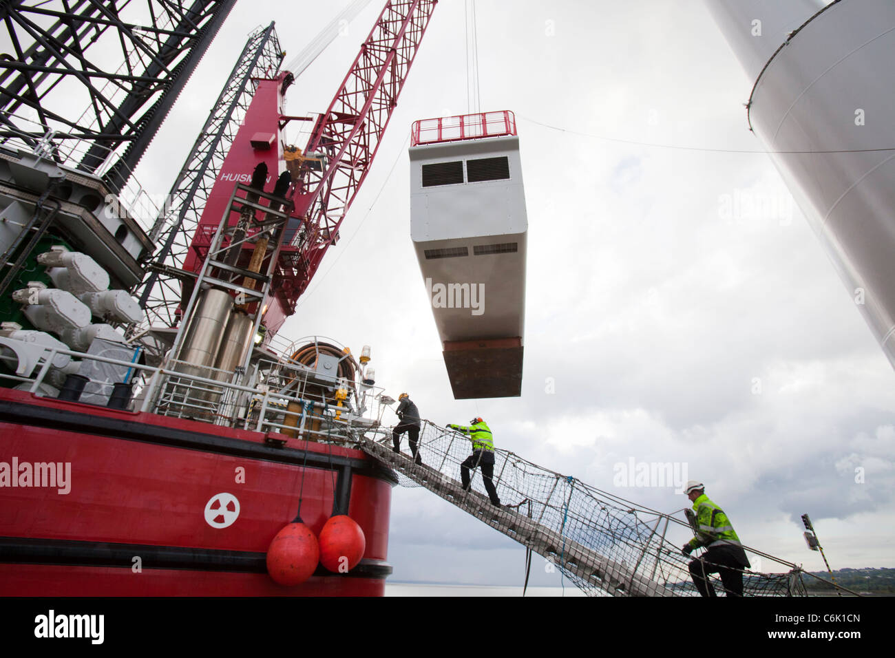 A jack up barge at Mostyn port and wind turbine parts Stock Photo - Alamy