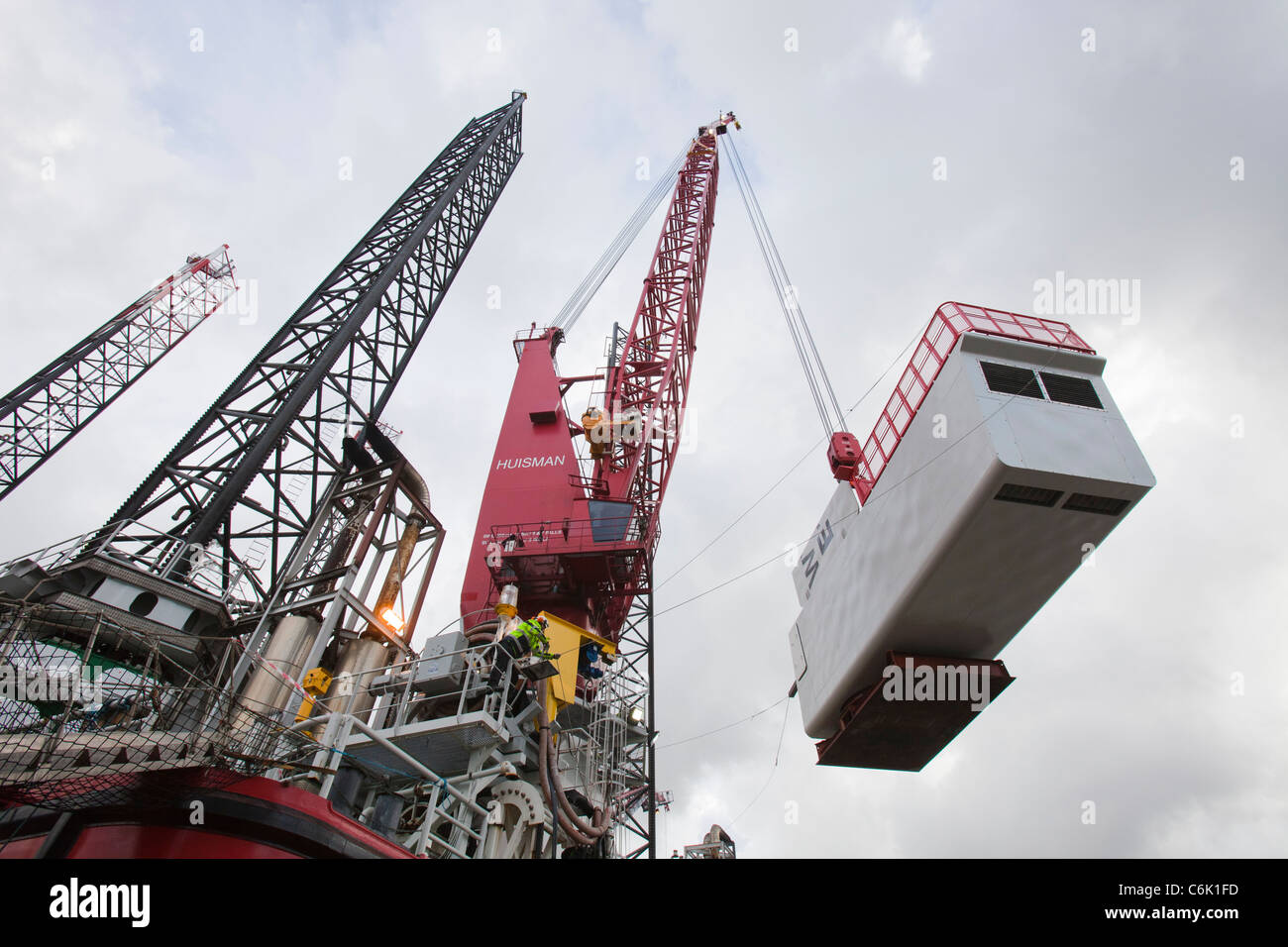 A jack up barge at Mostyn port and wind turbine parts Stock Photo - Alamy