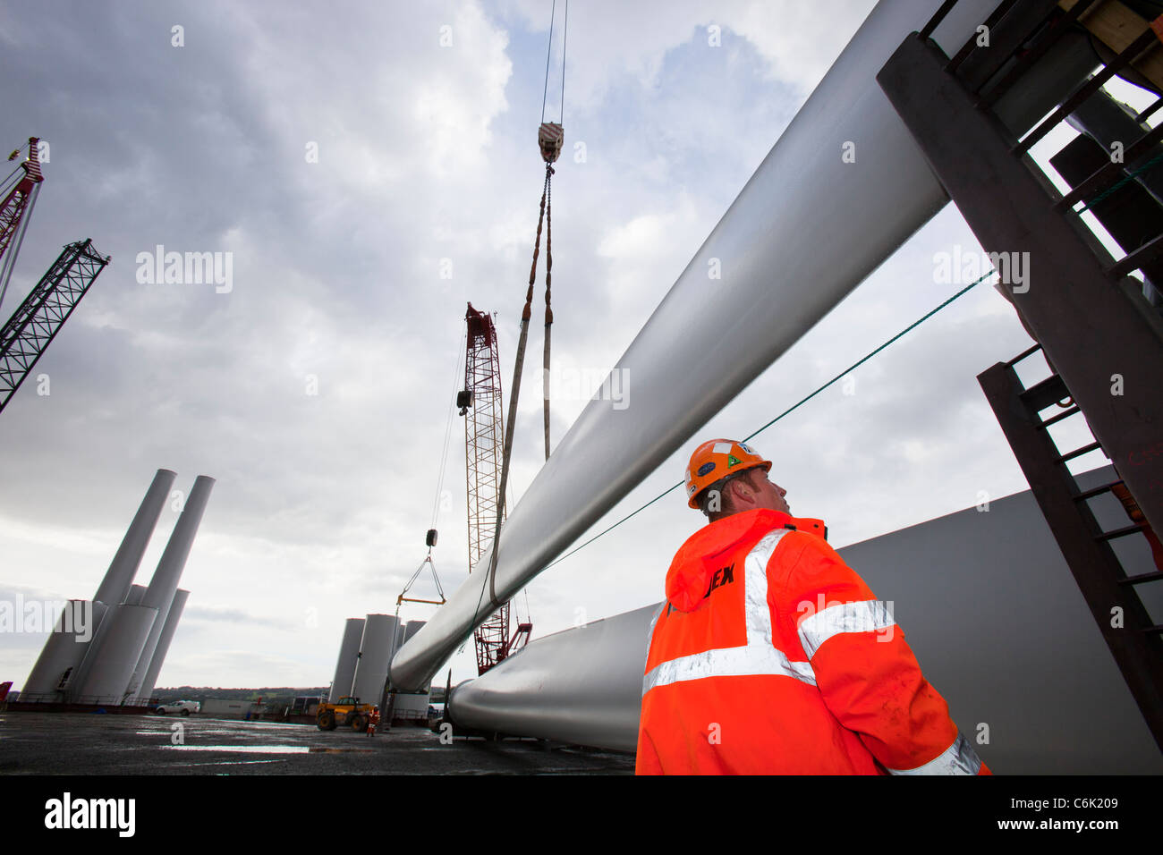 A jack up barge at Mostyn port and wind turbine parts Stock Photo - Alamy