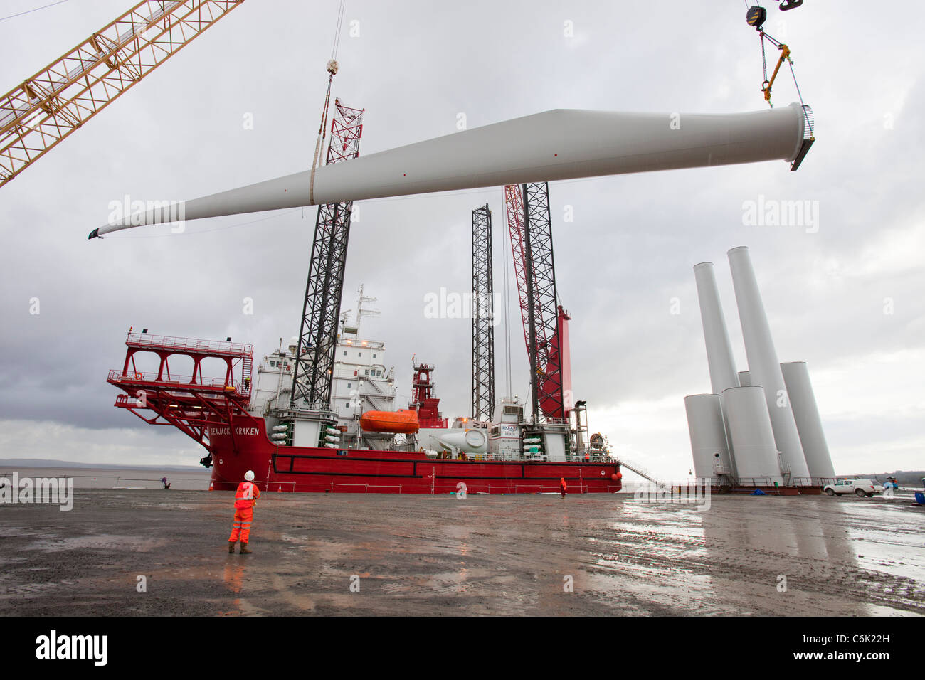 A jack up barge at Mostyn port and wind turbine parts Stock Photo - Alamy